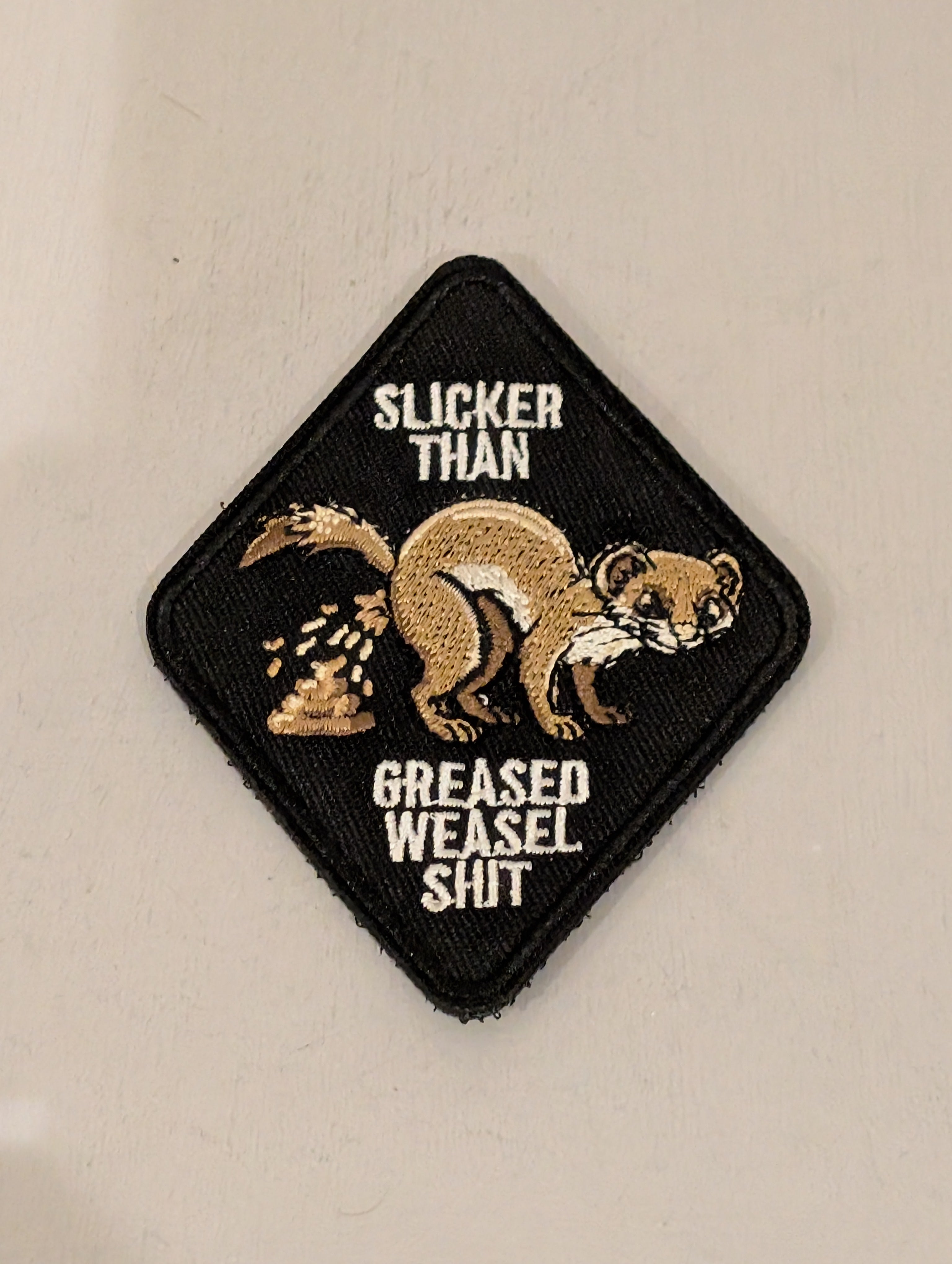 Greased Weasel Shit – London Militia Bespoke Collectibles
